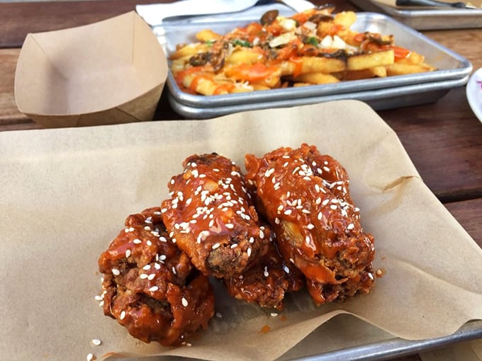 These aren't just wings – they're crispy, sesame-flecked flavor bombs that make you question your loyalty to every wing you've had before.
