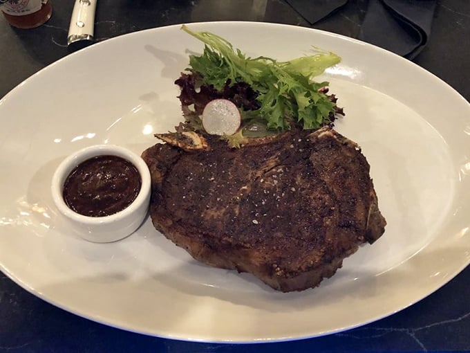 Not all heroes wear capes, but this steak wears a perfect sear. The simple garnish knows its role—supporting actor to the true star.