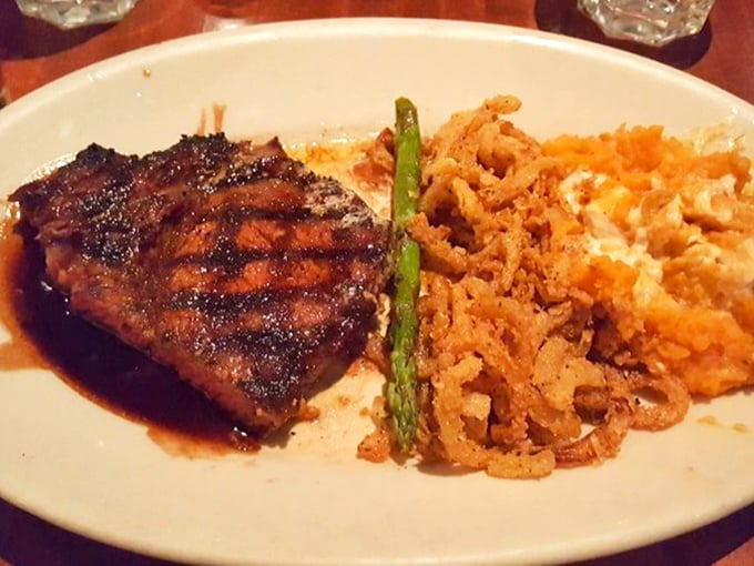 This isn't just a steak—it's a masterclass in fire and smoke, with those perfect grill marks telling a story of patience and precision.
