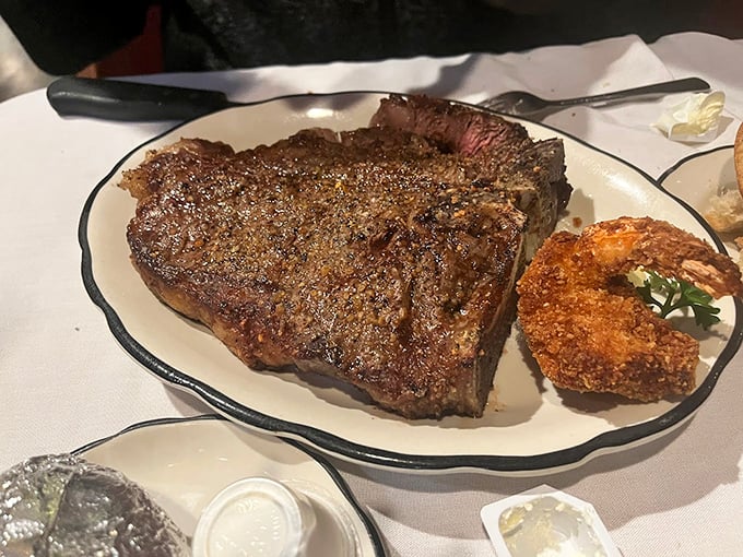 This T-bone doesn't just share a plate with a crab cake—they're having a full-on Maryland summit meeting about which one will make you happier.