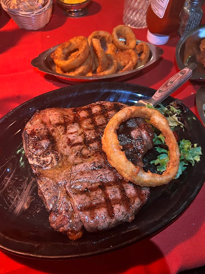 This isn't just a steak; it's a masterclass in the art of beef. That perfect char, that onion ring crown—this plate has more star power than most Hollywood blockbusters.