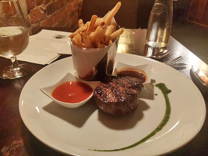 A perfectly seared filet mignon with duck fat fries—proof that sometimes the simplest combinations are actually secret pathways to happiness.