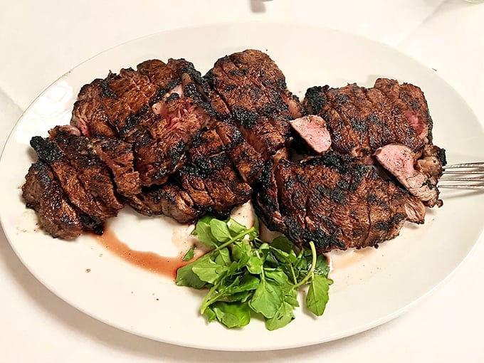 This isn't just steak; it's a masterclass in meat preparation. The perfect char giving way to juicy tenderness that makes vegetarians question their life choices.