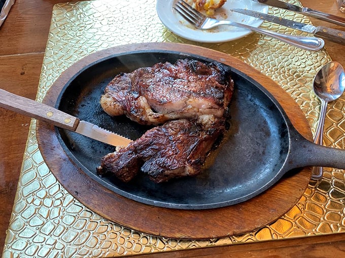 Carnivore heaven arrives on a sizzling skillet. This steak doesn't need a passport—it's already traveled from merely good to "why-is-my-plate-empty-already" territory.