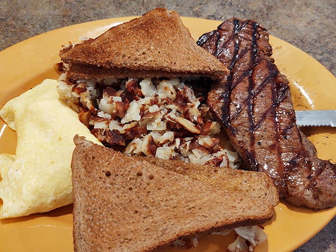 Behold the steak and eggs in their natural habitat—perfectly grilled, gloriously seasoned, and worth every minute of the drive to Massillon.
