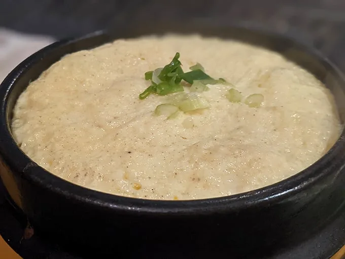 Behold the steamed egg—a cloud-like creation that somehow manages to be both impossibly fluffy and custardy at once. Simplicity, perfected.