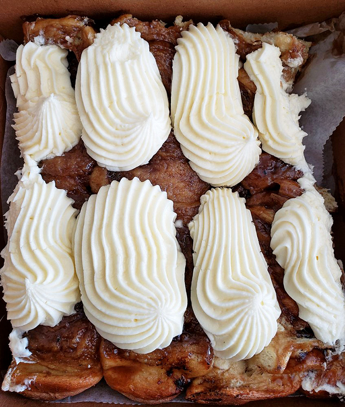 These aren't just sticky buns—they're edible architecture with perfect frosting swirls. Like Frank Lloyd Wright designed dessert with butter as the primary building material.