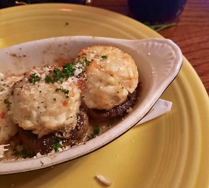 These aren't just stuffed mushrooms—they're little umami bombs of crab and cheese that might make you forget your table manners entirely.