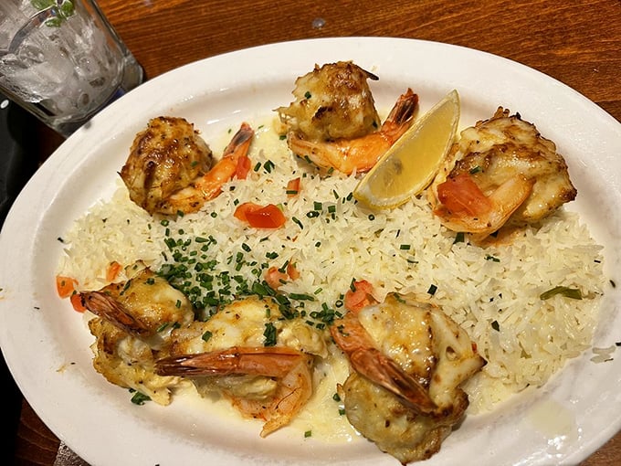 The star of the show: golden-brown stuffed shrimp nestled on a bed of rice. Each butterflied beauty bursts with crab imperial that would make Neptune himself weep.
