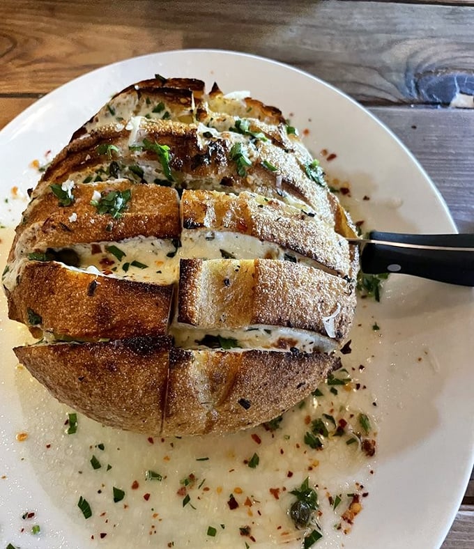 This isn't just bread—it's a sourdough treasure chest filled with melted goodness that makes you want to cancel your next three appointments.