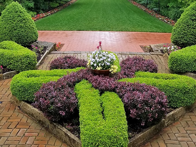 Garden geometry at its finest—these precisely trimmed hedges and colorful plantings prove that sometimes nature looks best when given a little artistic direction.