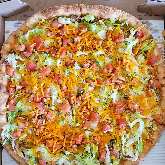 Behold the taco pizza masterpiece – where Italian tradition meets Tex-Mex flair in perfect, colorful harmony.
