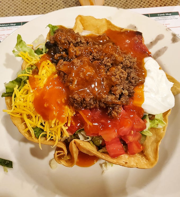 The legendary taco salad arrives like edible architecture—a crispy tortilla cathedral housing a congregation of seasoned beef, cheese, and fresh vegetables.