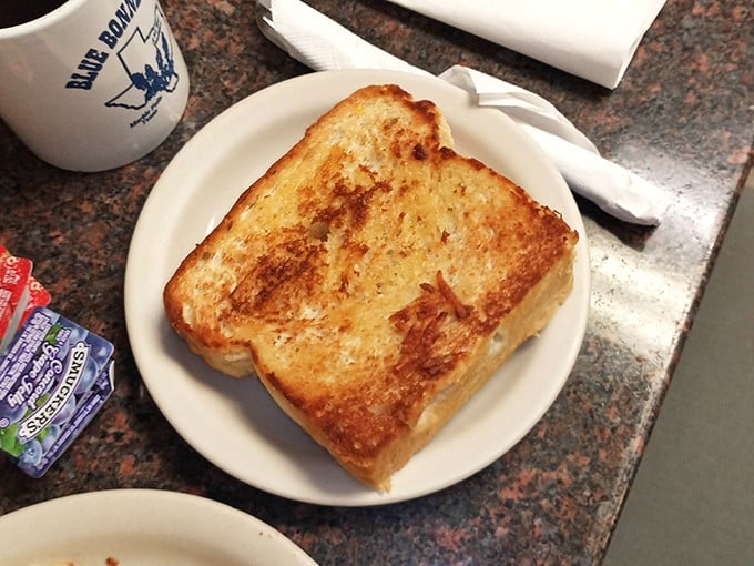 Texas toast perfection—golden-brown, butter-soaked, and substantial enough to support your breakfast dreams. This isn't toast; it's an institution.