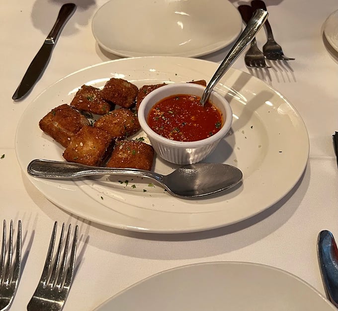 Golden-brown pillows of culinary perfection—toasted ravioli that makes you understand why St. Louisans would build monuments to this dish if they could.