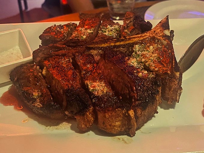 Behold the mighty Tomahawk—a primal cut that makes vegetarians reconsider their life choices and meat-eaters weak in the knees.