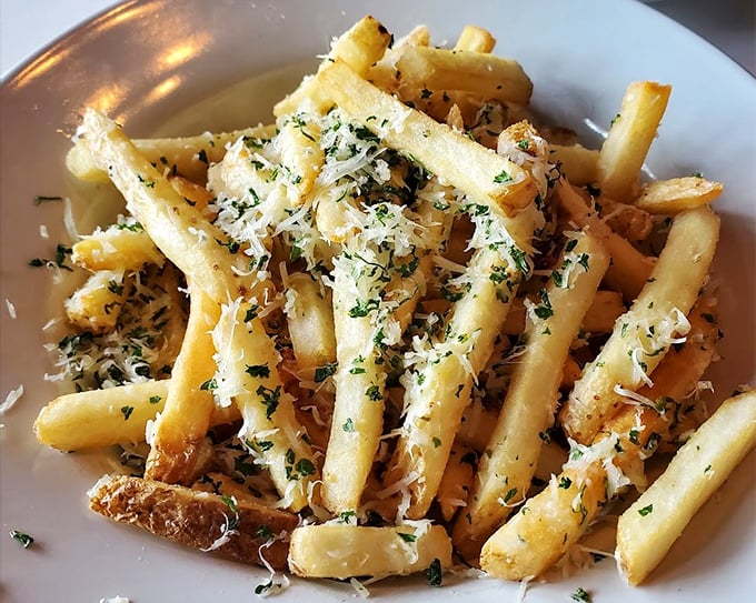 Golden, crispy truffle fries that make you pause mid-conversation. The parmesan and herbs aren't just toppings—they're a declaration of potato perfection.