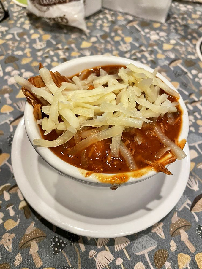 This isn't just turkey chili—it's a warm hug in a bowl, topped with melted cheese that stretches dramatically with each spoonful. 