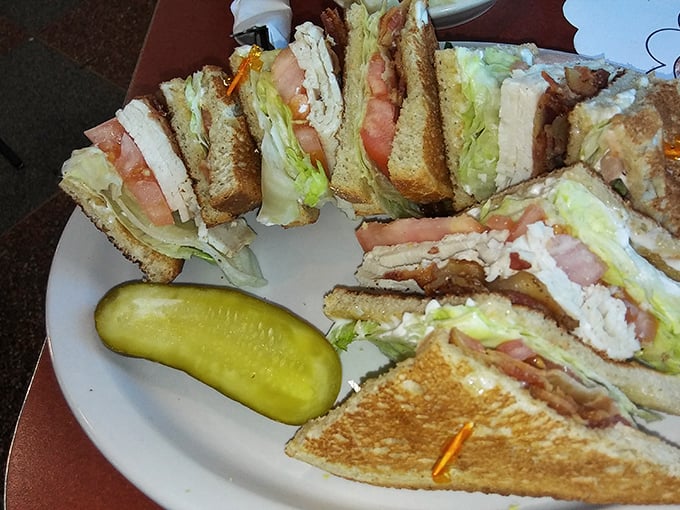 Architecture in sandwich form! This club doesn't require a membership card, just an appreciation for perfectly stacked layers and that pickle sidekick.