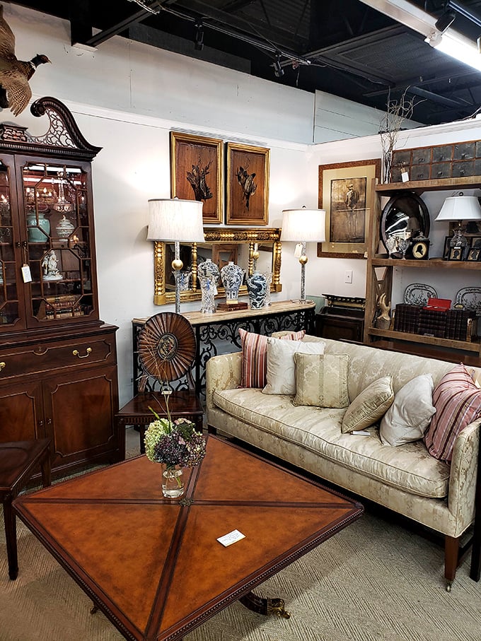 A living room setup that whispers "sit down and stay awhile" – though that coffee table has probably seen more fascinating guests than your dinner parties. 