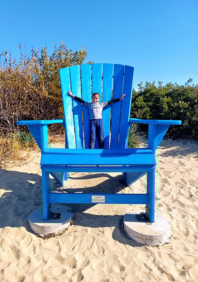 The iconic blue Adirondack chair – where beach memories are made and Instagram posts are born. Bigger than life, just like your vacation stories.