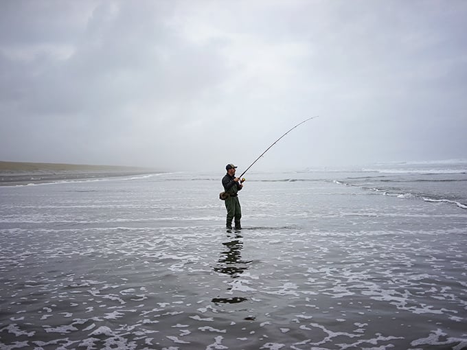 Patience personified – a solitary angler tests his luck against the Pacific, standing where Lewis and Clark once gazed westward.