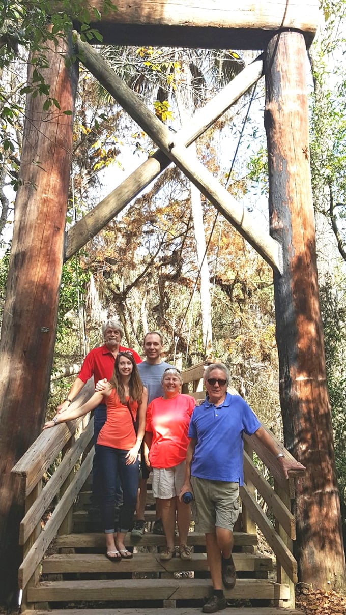 Families create memories on trails built to last generations. The wooden framework stands like nature's doorway to adventure.