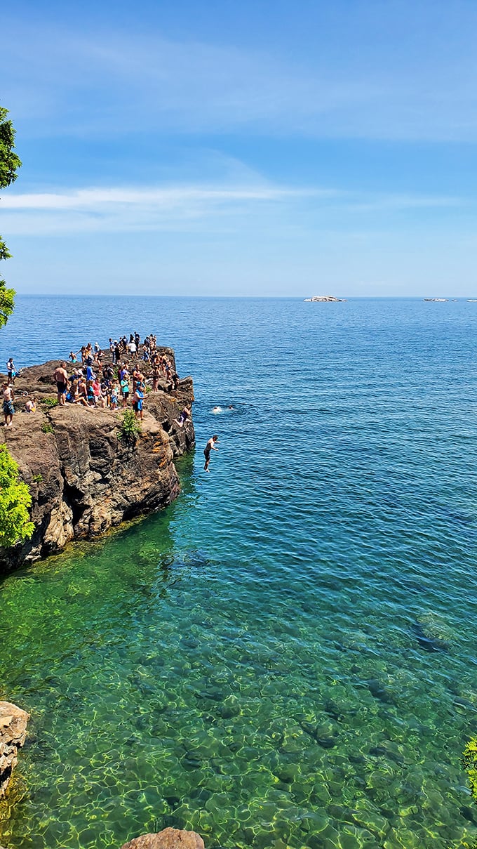Summer crowds gather on the cliff edges, proving that some Instagram spots actually deserve the hype.