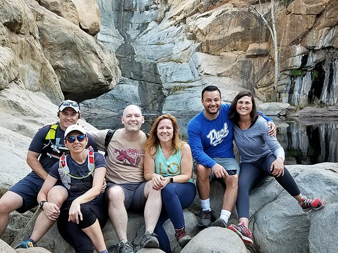 Squad goals achieved! Nothing bonds friends like that collective "we made it" moment at the base of an 80-foot natural wonder.