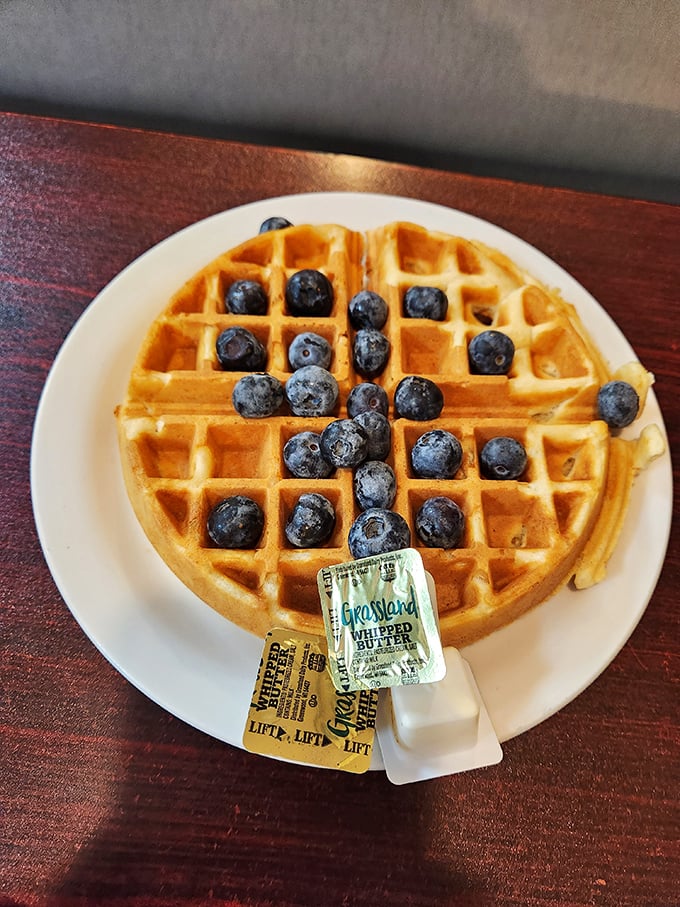 Golden perfection meets blueberry bliss. Those perfect grid indentations aren't just for show – they're nature's syrup reservoirs.