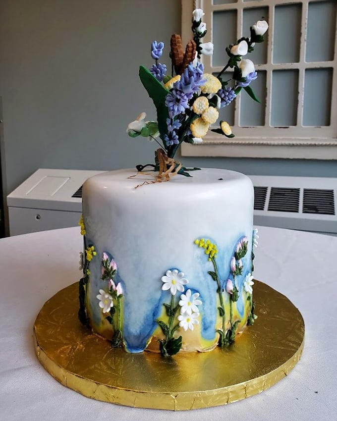 This wedding cake isn't just beautiful – it's botanical wizardry. Those flowers look so real you'd swear they were plucked from an enchanted garden.