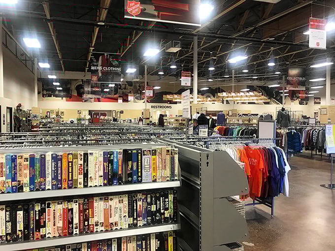Books and clothing peacefully coexist in this organized chaos, where VHS tapes still have a fighting chance at a second life.