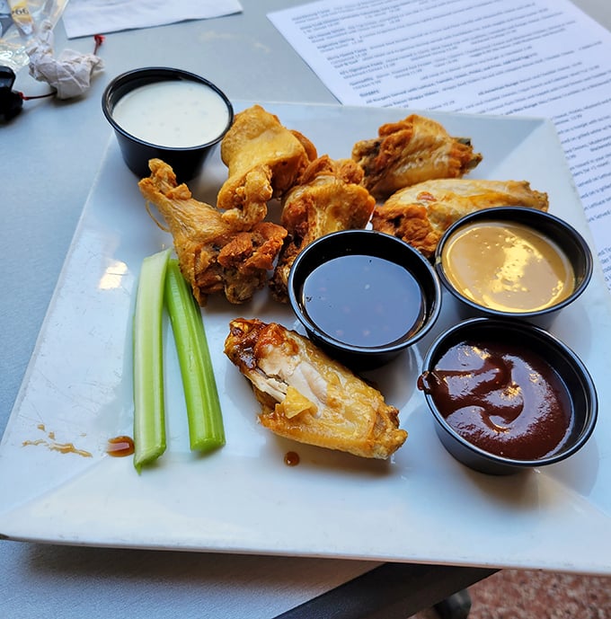 These wings don't just come with multiple sauces—they come with a silent guarantee that you'll be planning your next visit before the last bite.