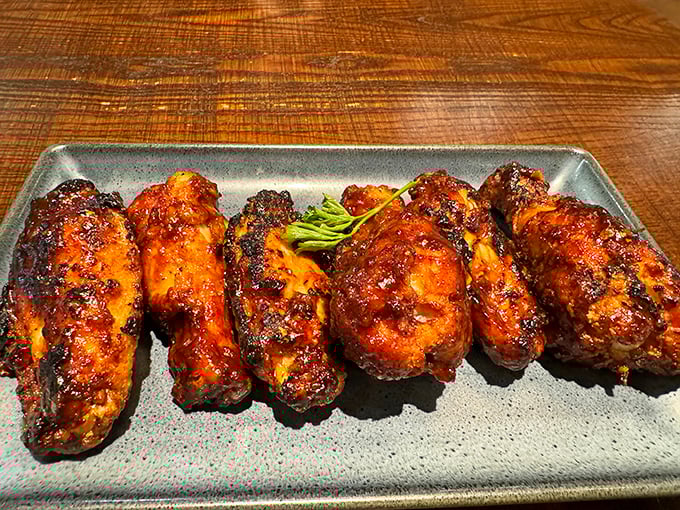 These wings aren't just smoked, they're transformed—like Clark Kent stepping into a phone booth and emerging as Superman with barbecue sauce.