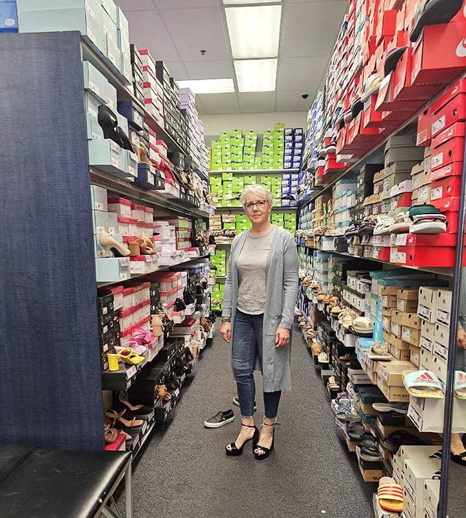 A shoe paradise where sensible shoppers become footwear philosophers, contemplating whether they need a fifth pair of black boots. (Spoiler: yes.)