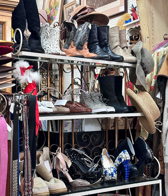 Boot heaven exists! Vintage cowboy boots mingle with elegant heels on wrought iron shelves, each pair whispering stories of dance floors and adventures past.