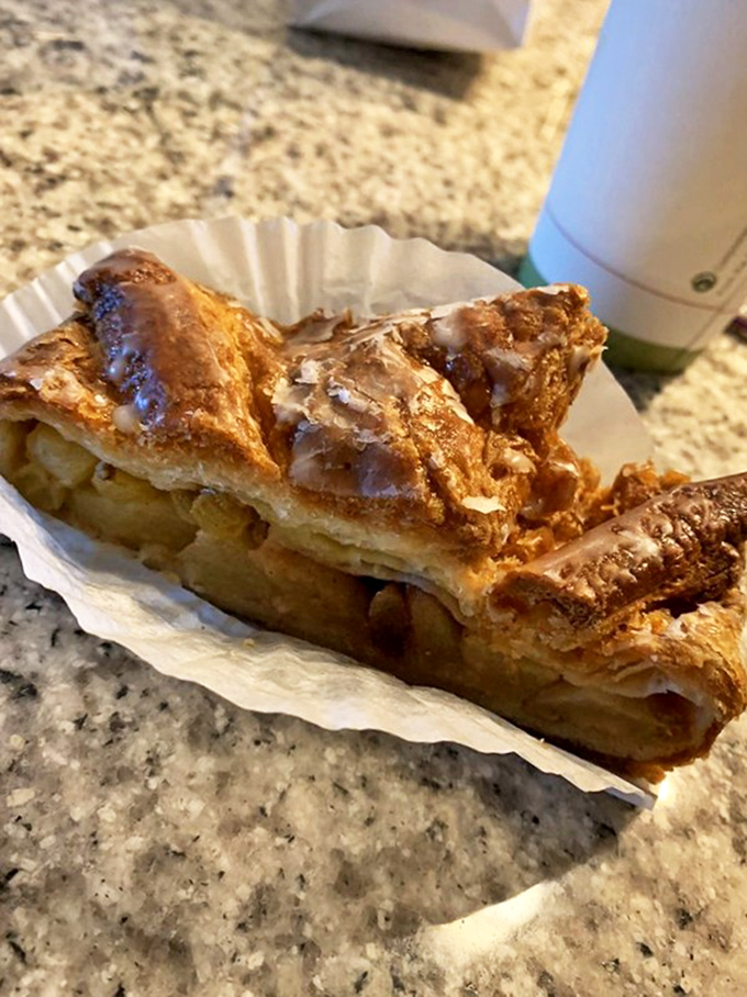 Flaky, buttery layers cradle tender apples in this strudel that would make Mozart himself compose a symphony of appreciation. Pure edible artistry.