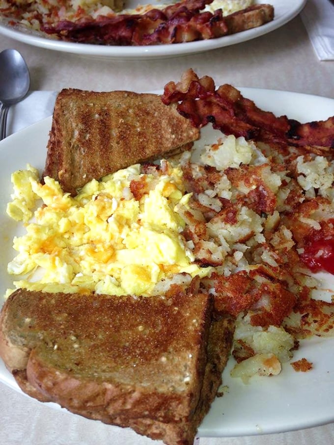 Breakfast perfection doesn't need fancy plating. Golden toast, perfectly crisp bacon, and eggs that would make a chicken proud—simple pleasures at their finest.