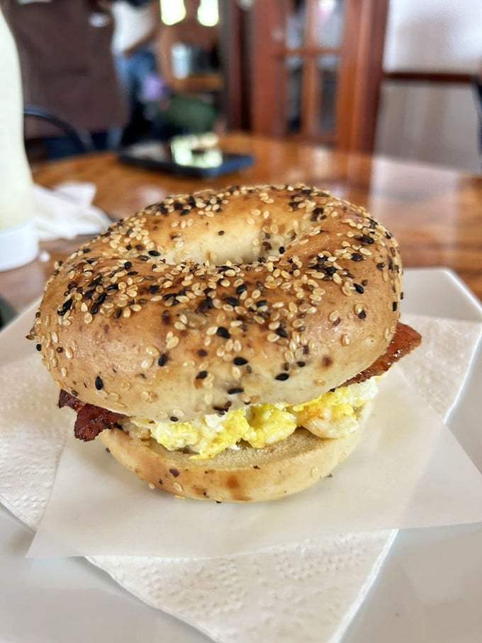 This isn't just a bagel sandwich—it's breakfast architecture. Golden-toasted exterior, fluffy eggs, and that perfect ratio of fillings that won't end up in your lap.