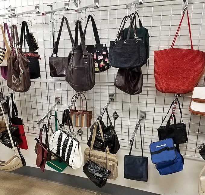 The handbag wall – where yesterday's designer splurges become today's incredible finds. That red tote is practically screaming your name.