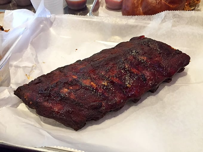 These ribs don't just fall off the bone – they practically leap into your mouth, sporting a bark so perfect it deserves its own appreciation society.