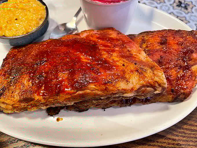 These ribs don't just fall off the bone—they practically leap into your mouth with a smoky enthusiasm that borders on supernatural.