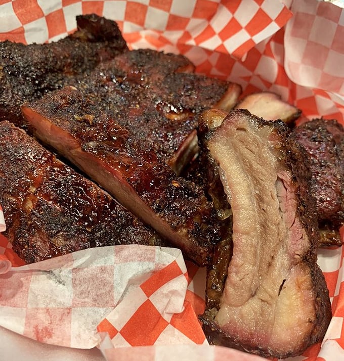 These ribs don't just fall off the bone – they make a compelling argument for why you should cancel your afternoon plans and surrender to meat-induced bliss.