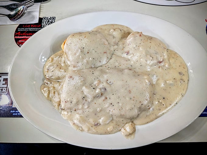 Biscuits and gravy that doesn't just smother—it embraces. This plate isn't a meal, it's a warm hug from your grandmother's kitchen.