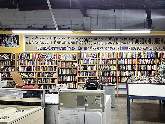 Bibliophile paradise alert! Enough books to build a fortress of knowledge, with a reminder overhead that your shopping supports disadvantaged children.