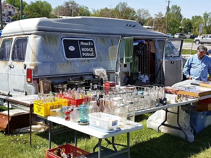 Vintage glassware displayed from a well-traveled van—proof that the best antique shops sometimes come with wheels and stories from the road.