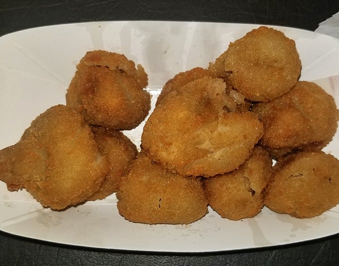 Golden breaded mushrooms arrive like edible treasures, each bite delivering that perfect crunch followed by earthy goodness inside.