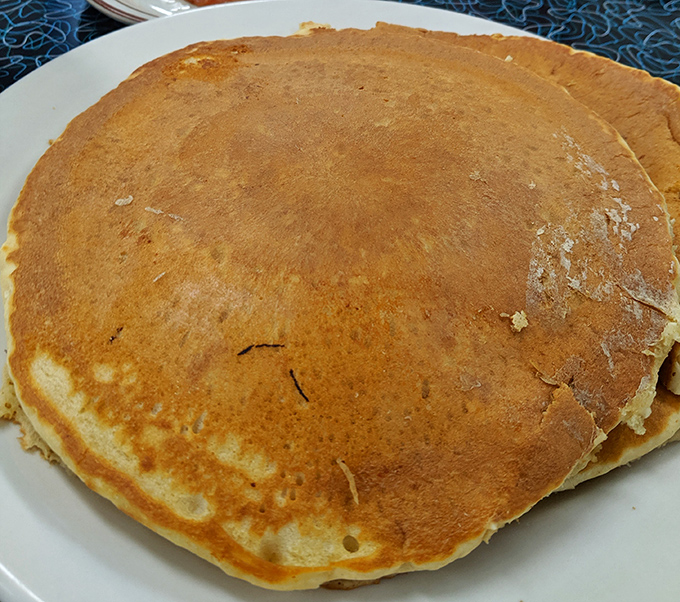 This pancake isn't just breakfast—it's edible therapy. Golden-brown, slightly crisp at the edges, and impossibly fluffy in the center. Breakfast nirvana achieved.