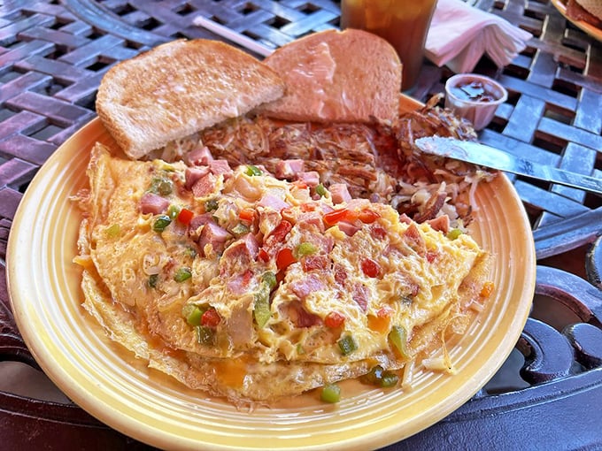 This colorful omelet isn't just breakfast, it's edible artwork—a masterpiece of eggs, ham, and vegetables that puts ordinary breakfasts to shame.
