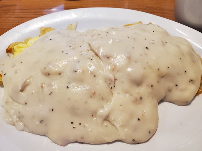 Biscuits smothered in creamy sausage gravy—the kind of breakfast that makes you want to cancel your other meals for the day.